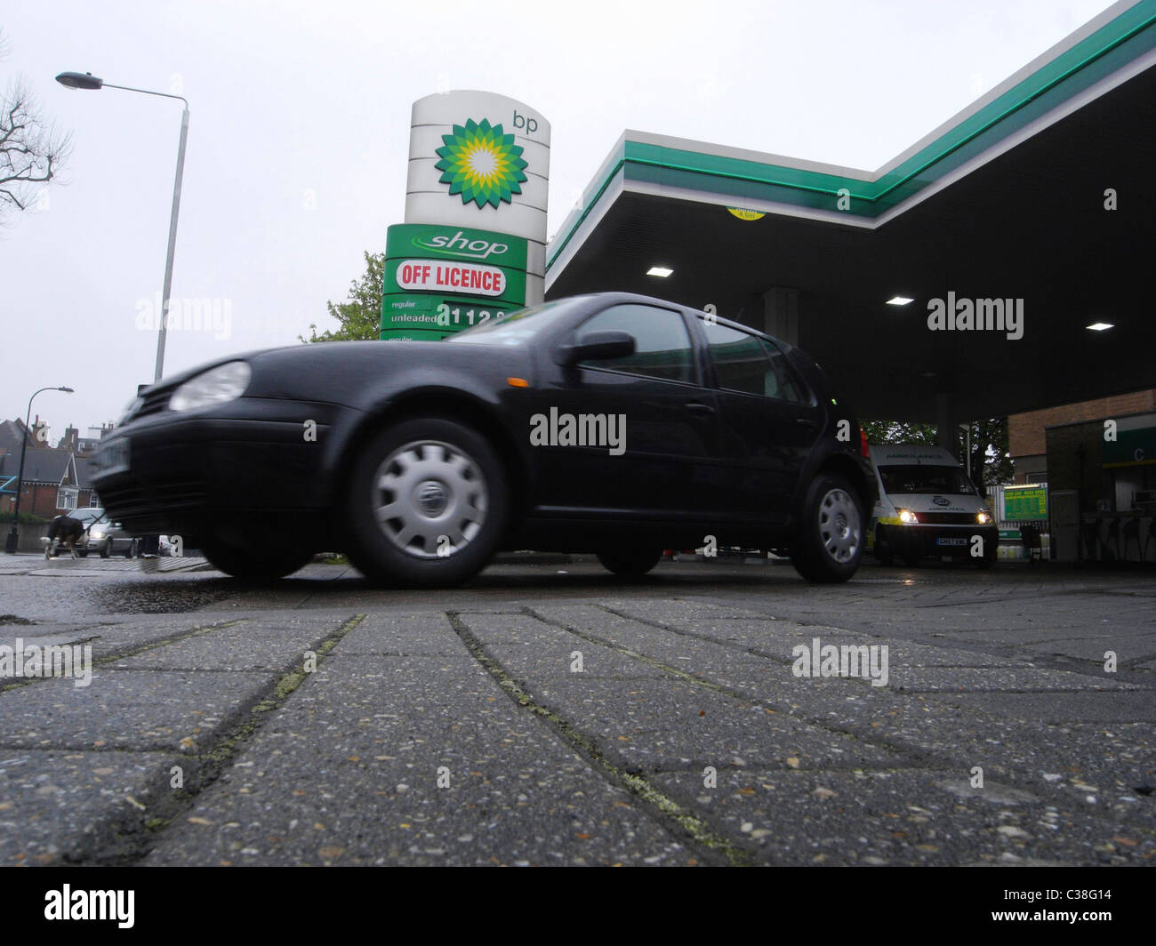 A car pulling out of a BP filling station Stock Photo - Alamy