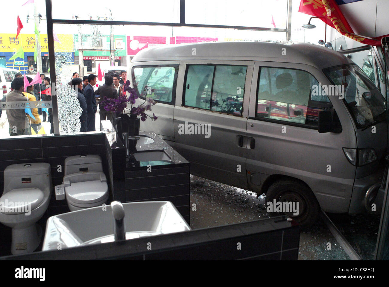 Toilet stop A mini-van in China came to an abrupt halt after crashing ...