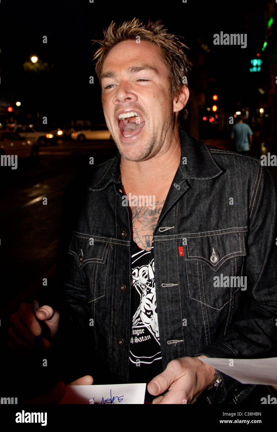 Mark McGrath of the band Sugar Ray signs autographs for fans outside ...