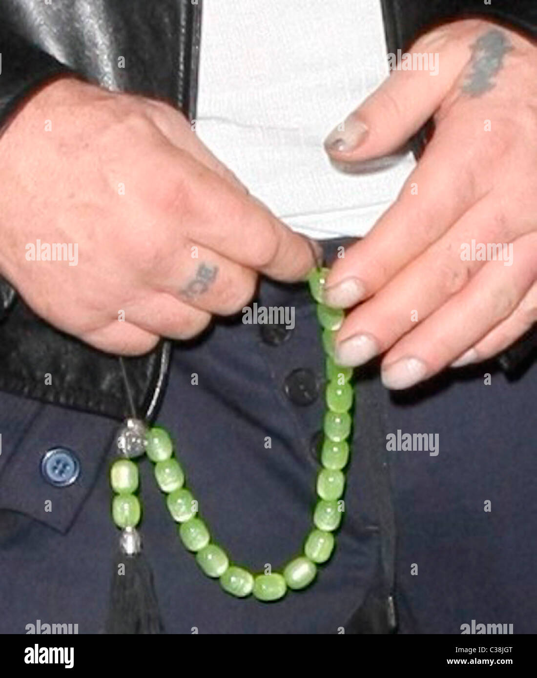 Mickey Rourke leaving a Hollywood nightclub carrying a string of jade ...