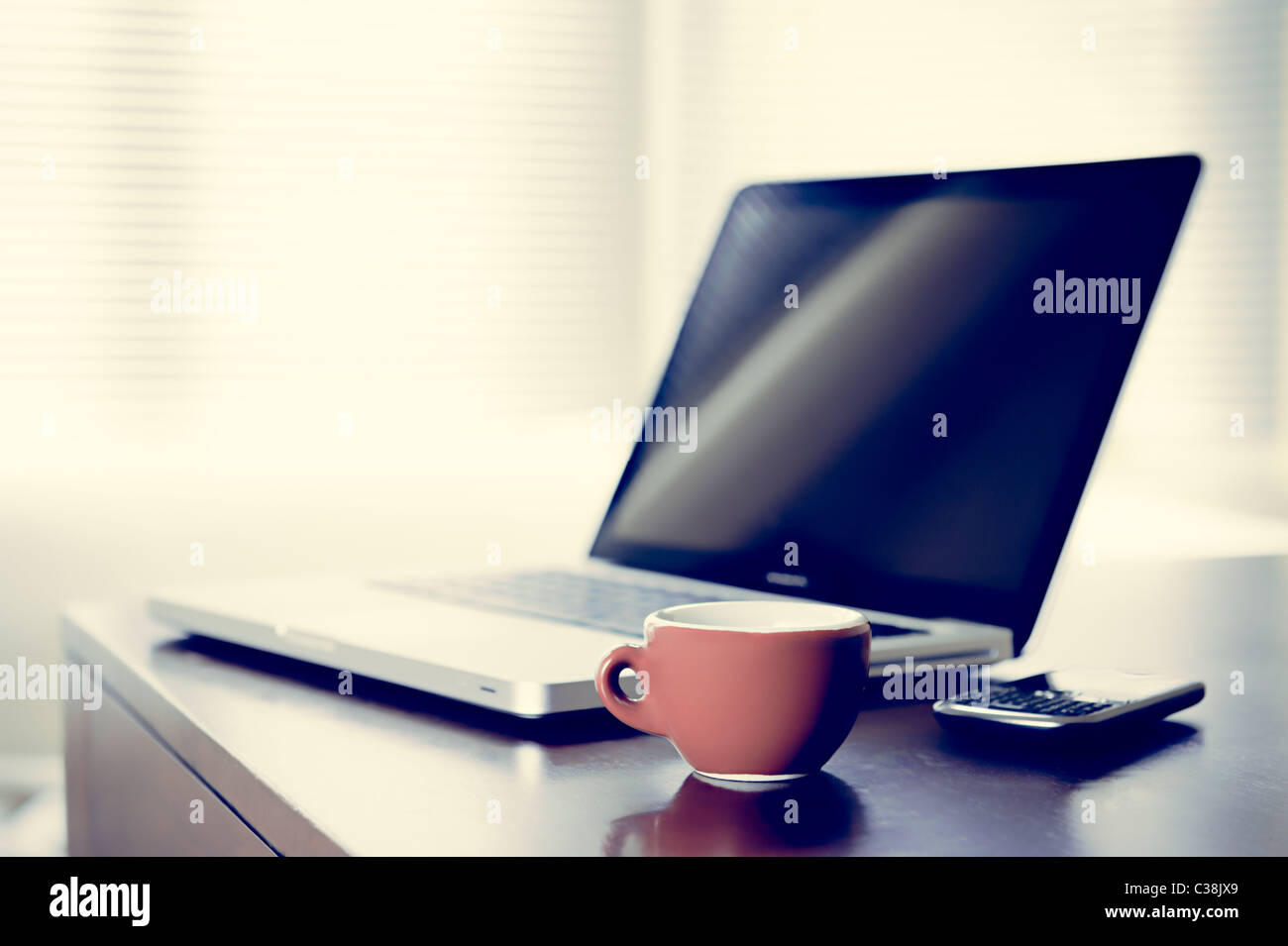 coffee break concept, the image show a laptop, mobile phone and a cup ...
