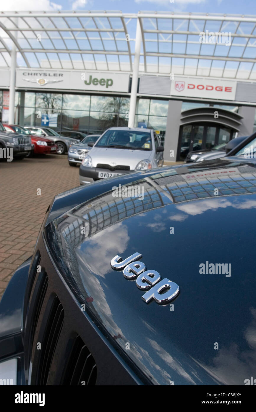 A Jeep motor car outside a dealership showroom in Cambridge Stock Photo ...
