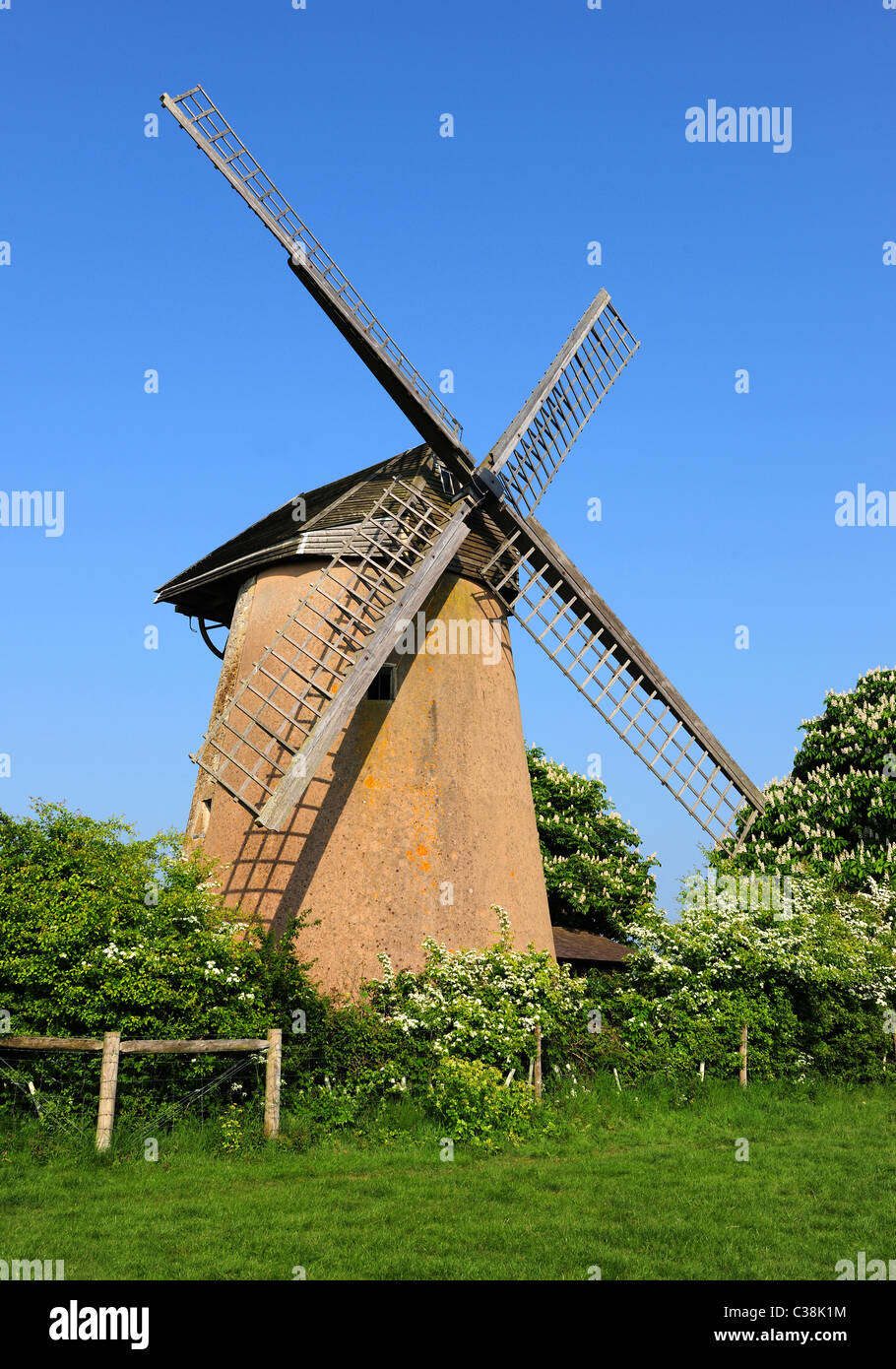 An old 17th century windmill against a clear blue sky Stock Photo - Alamy