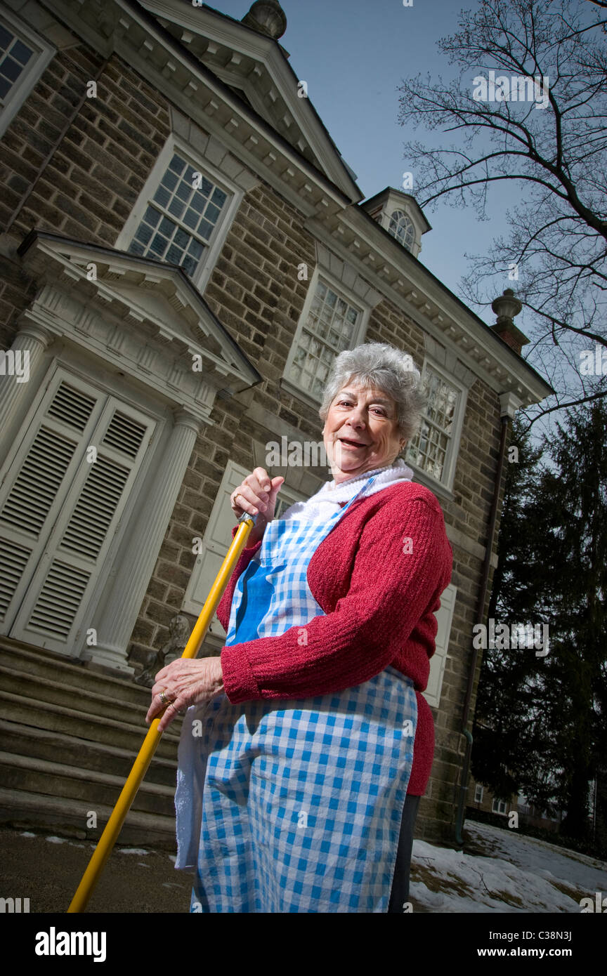 Elderly Woman Sweeping Outside Old Historic House, Philadelphia, USA ...