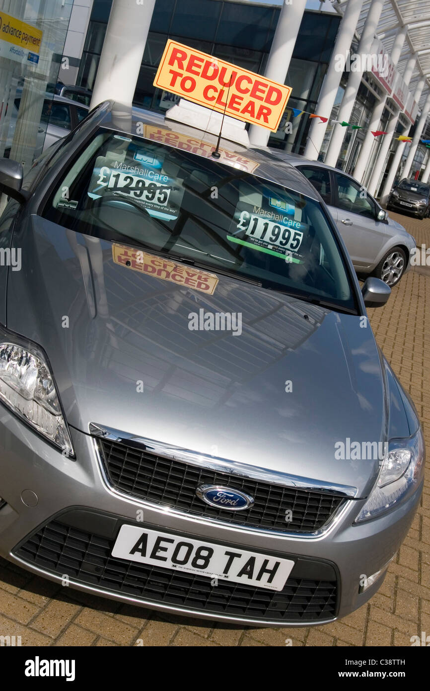 A Ford motor car parked in the lot of a dealership in Cambridge with a ...