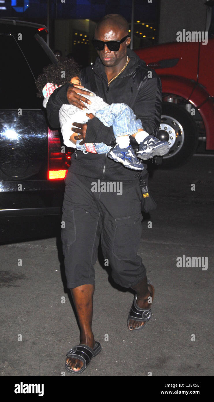 Seal, carrying his son Johan Samuel, arrives at Radio City Music Hall ...