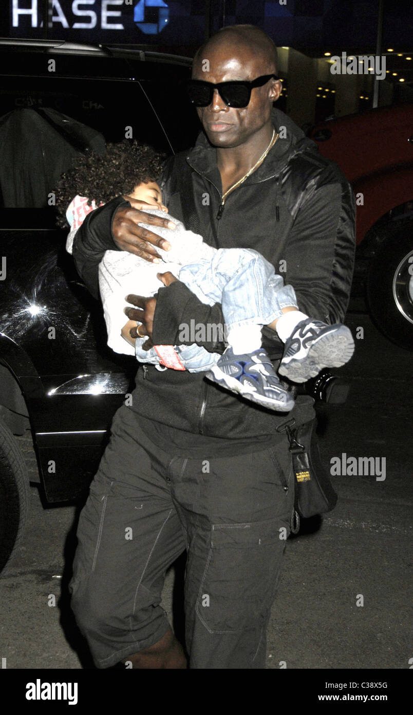 Seal, carrying his son Johan Samuel, arrives at Radio City Music Hall ...