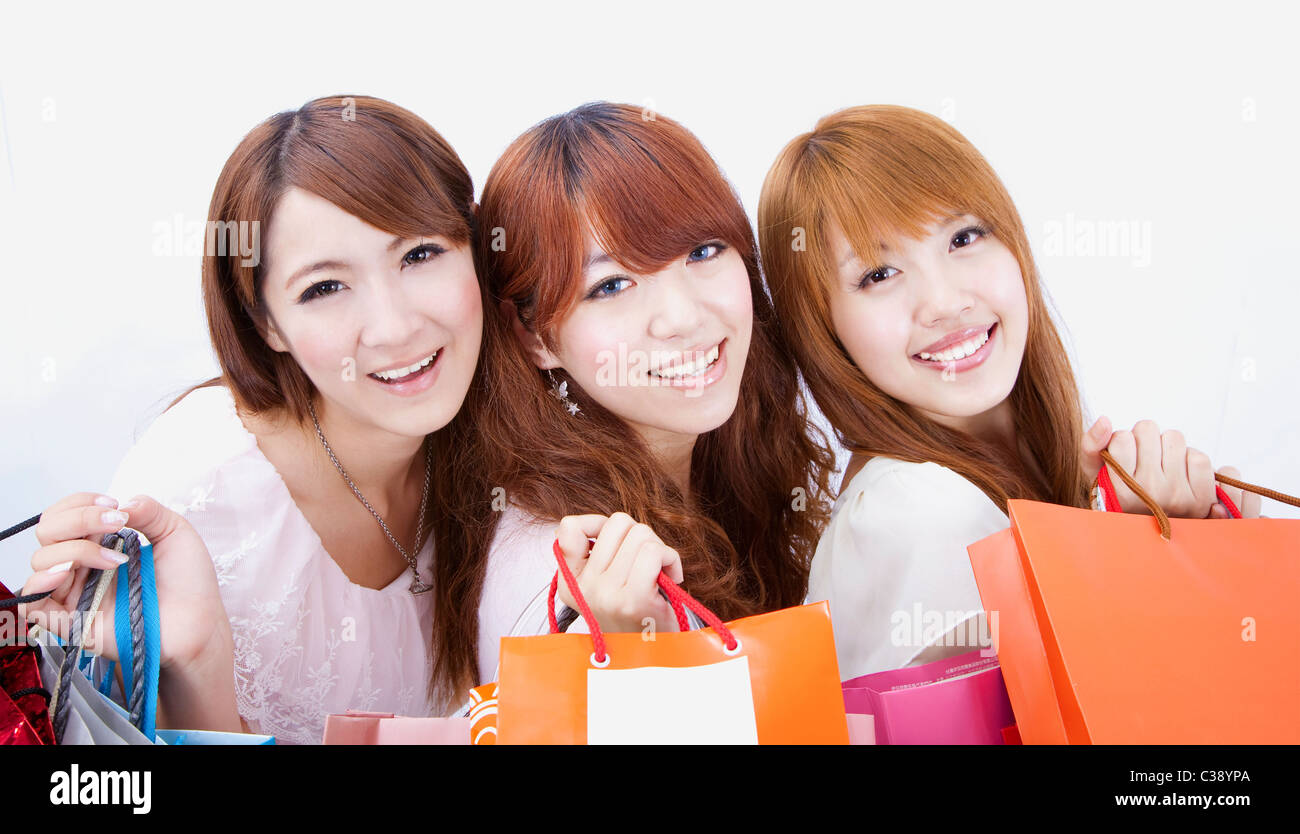 three happy shopping girl Stock Photo - Alamy