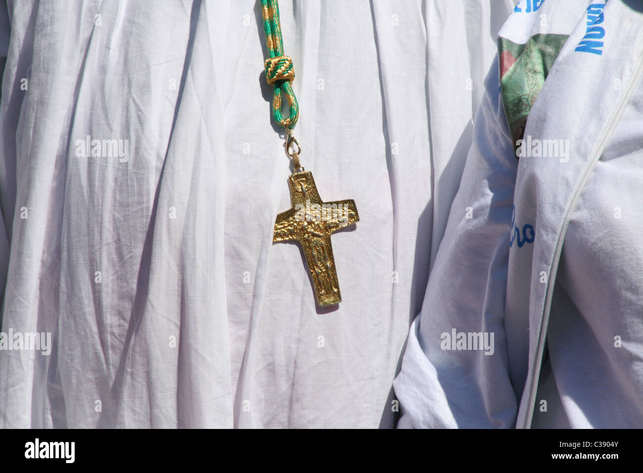 priest wearing a gold cross in rome italy Stock Photo - Alamy