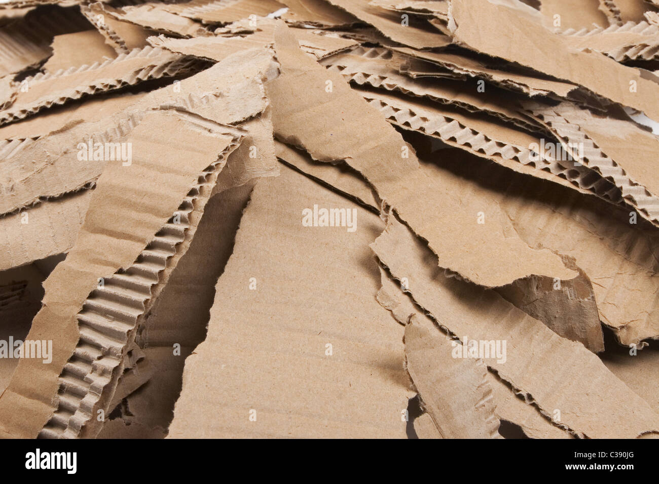 front view of corrugated cardboard torn pile Stock Photo - Alamy