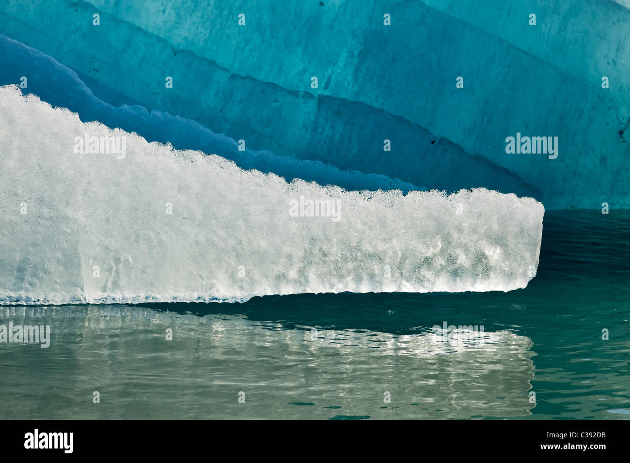 Layers/color changes indicate stages of melting on this iceberg from ...