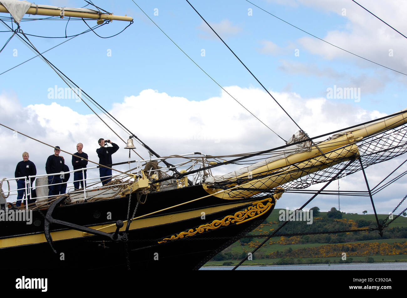 Crew member stand on the deck of the Danish tall ship Georg Stage as ...