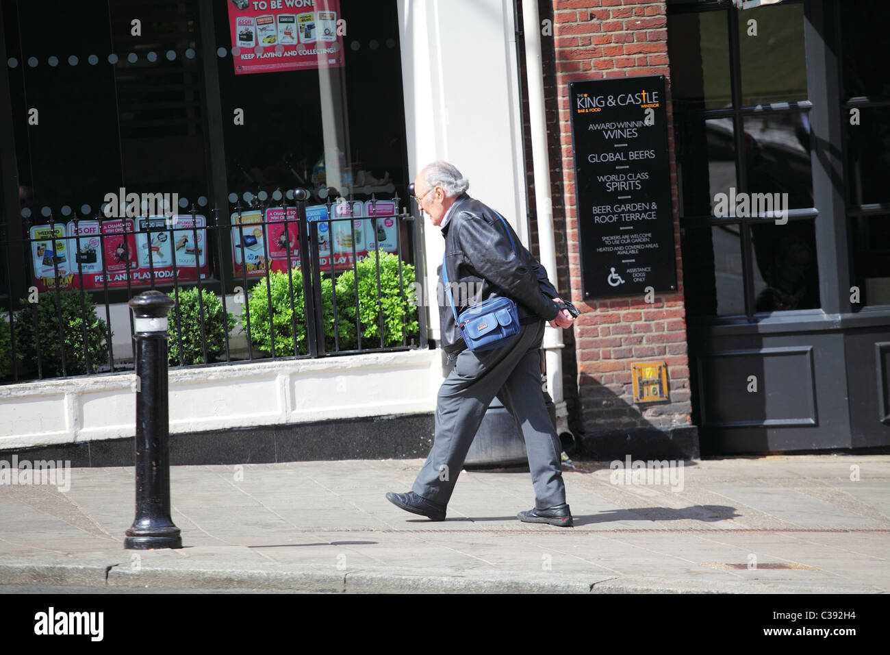 Old man walking on the streets of Windsor Stock Photo - Alamy