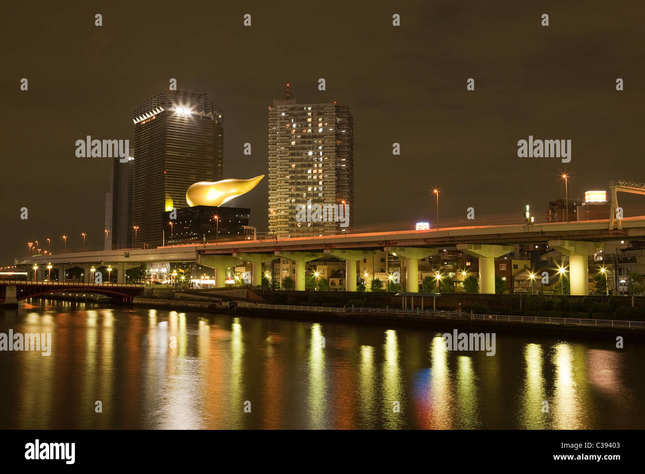 ASAHI BEER TOWER ACROSS THE RIVER AT NIGHT ,ASAKUSA, TOKYO, JAPAN Stock ...