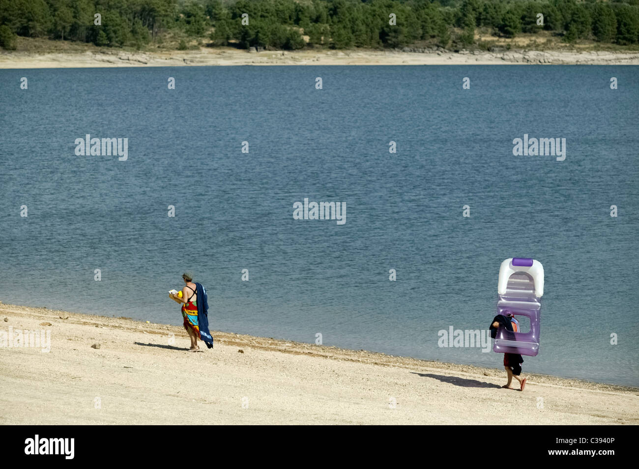 People walking on a beach Stock Photo - Alamy