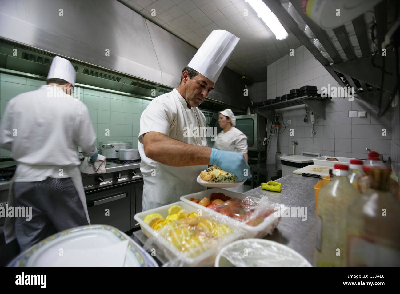 Chefs preparing food in Restaurant's modern professional kitchen Stock ...
