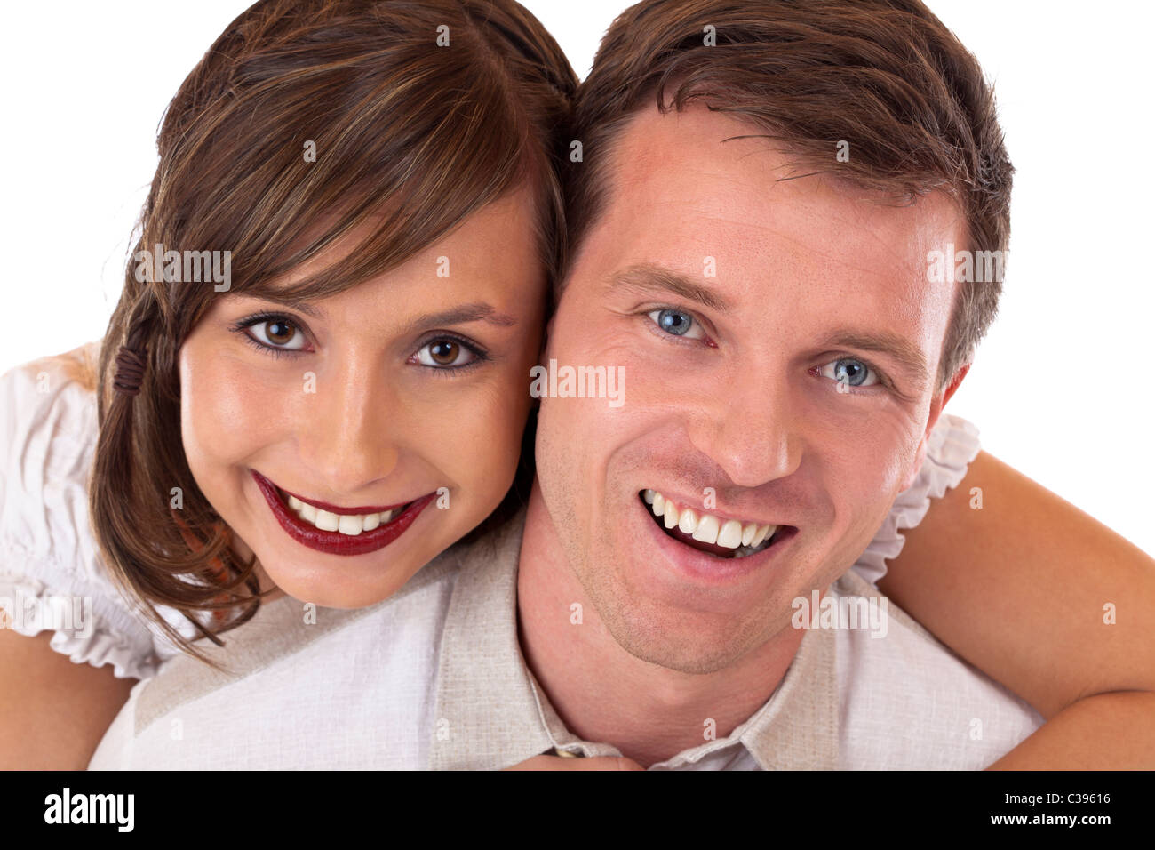 Young, beloved, happy couple smiles at camera. Isolated on white ...