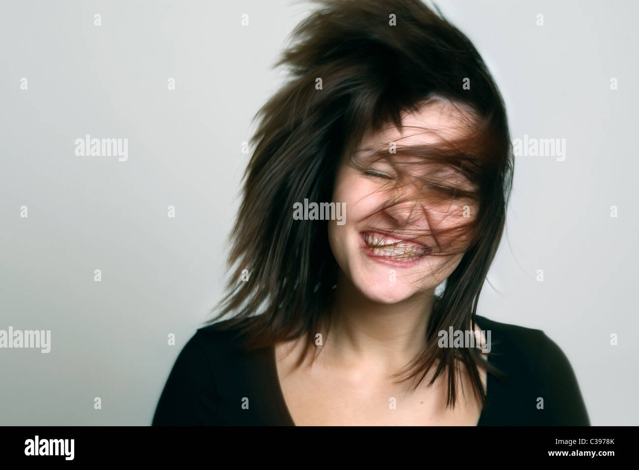 A woman laughing cheerfully Stock Photo - Alamy