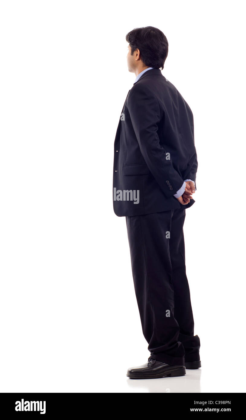 Asian business man from the back - looking at something over a white ...