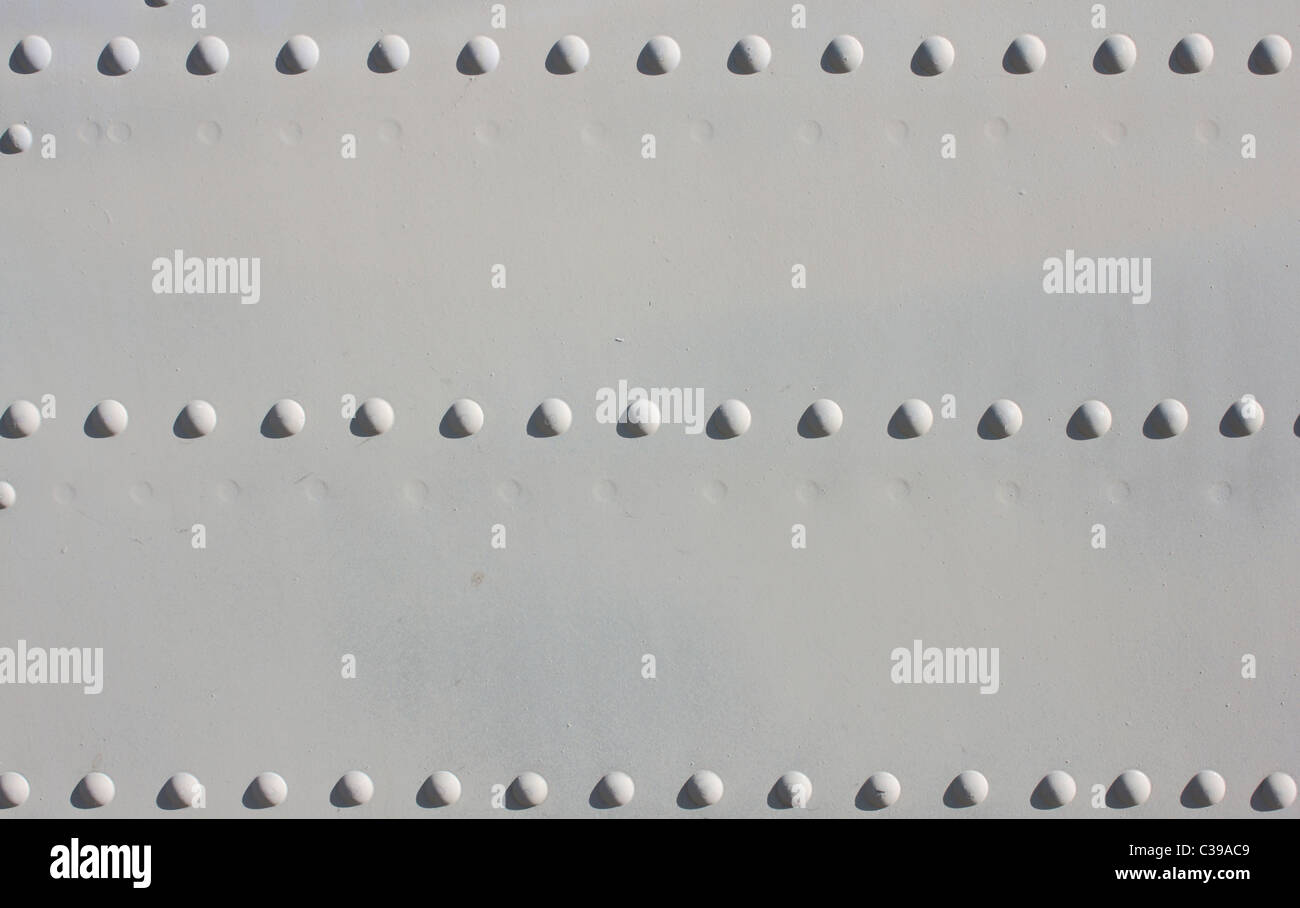 A silver painted metal aircraft background with rivets Stock Photo - Alamy