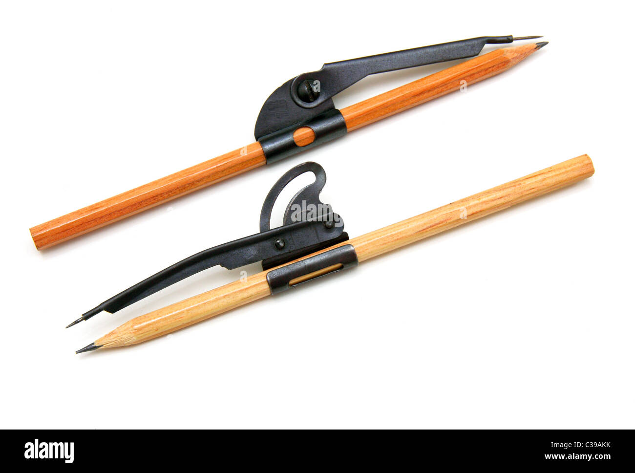 Two pencils and compasses on a white background Stock Photo - Alamy