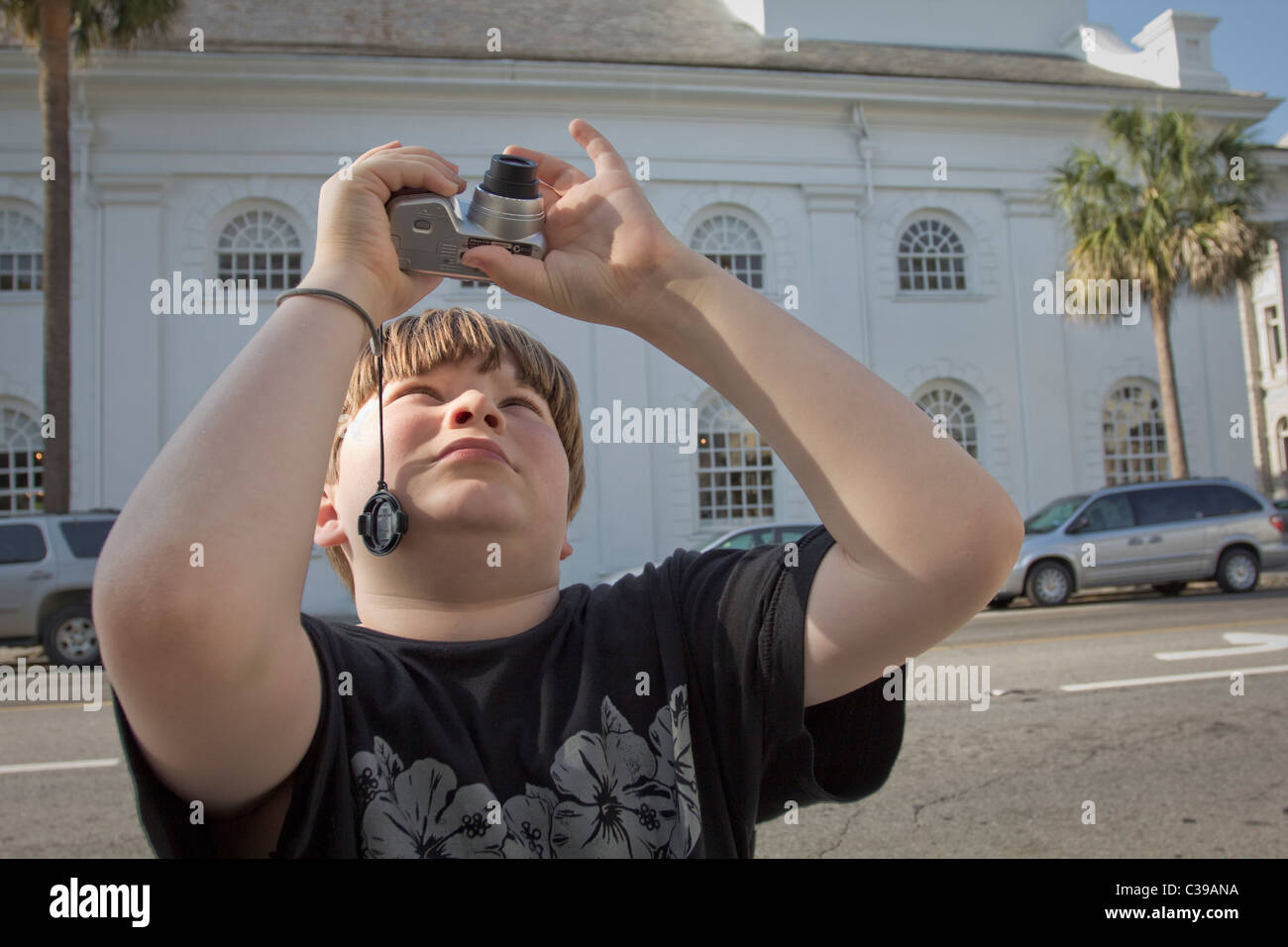 young boy using digital camera to take photos Stock Photo - Alamy