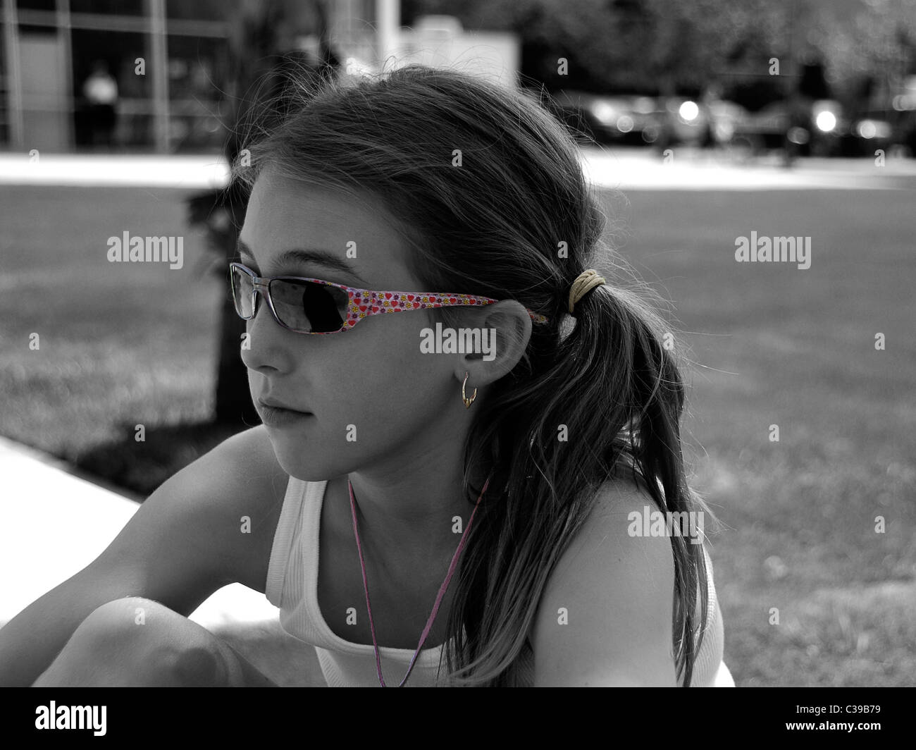 Two-toned photograph of a young girl contemplating life Stock Photo - Alamy