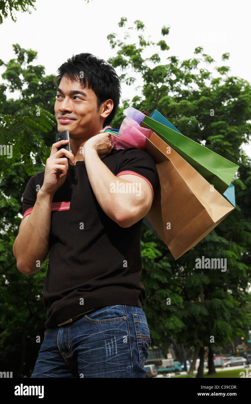 Man holding money bags hi-res stock photography and images - Alamy