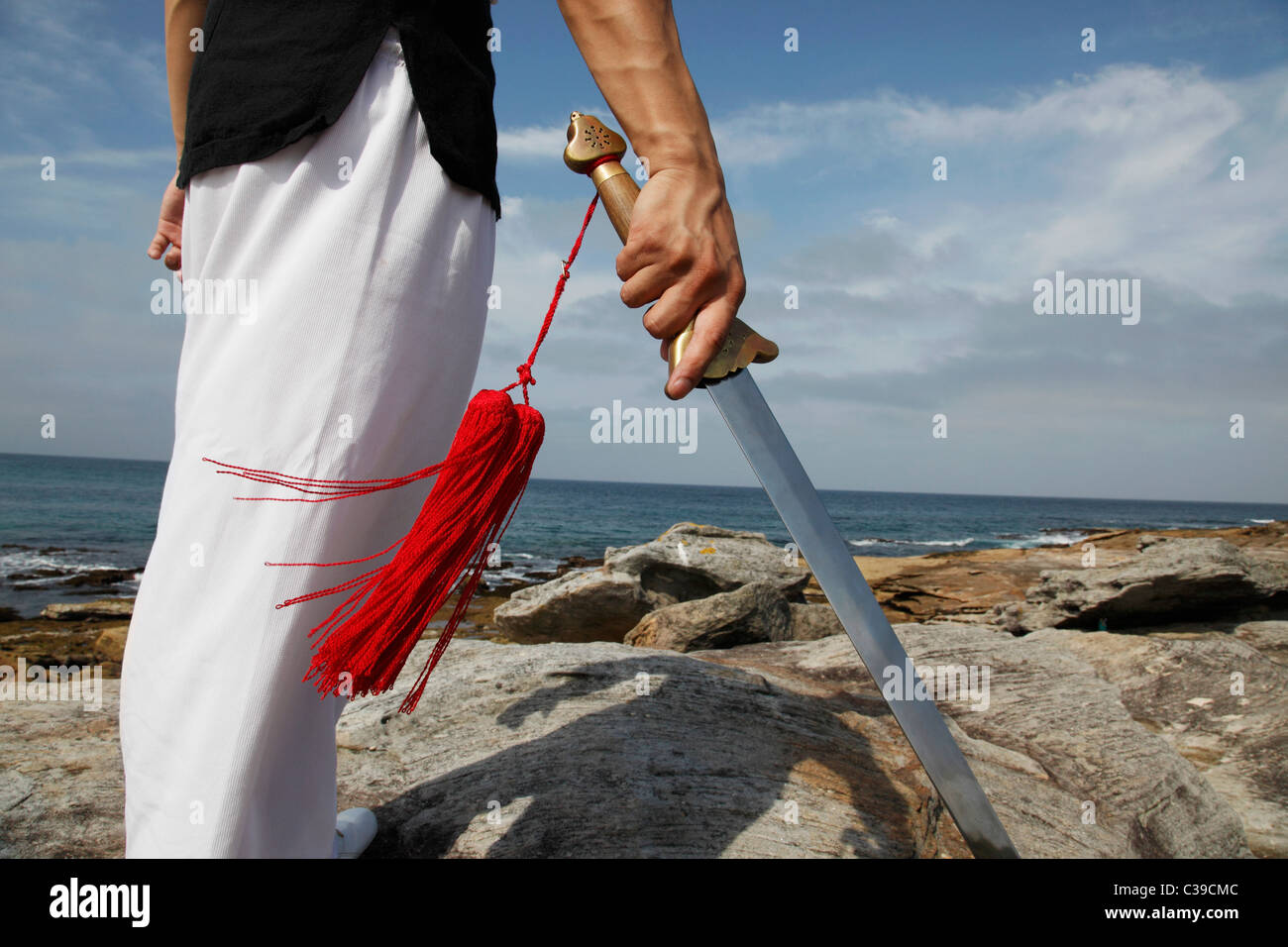 Man holding sword hi-res stock photography and images - Alamy