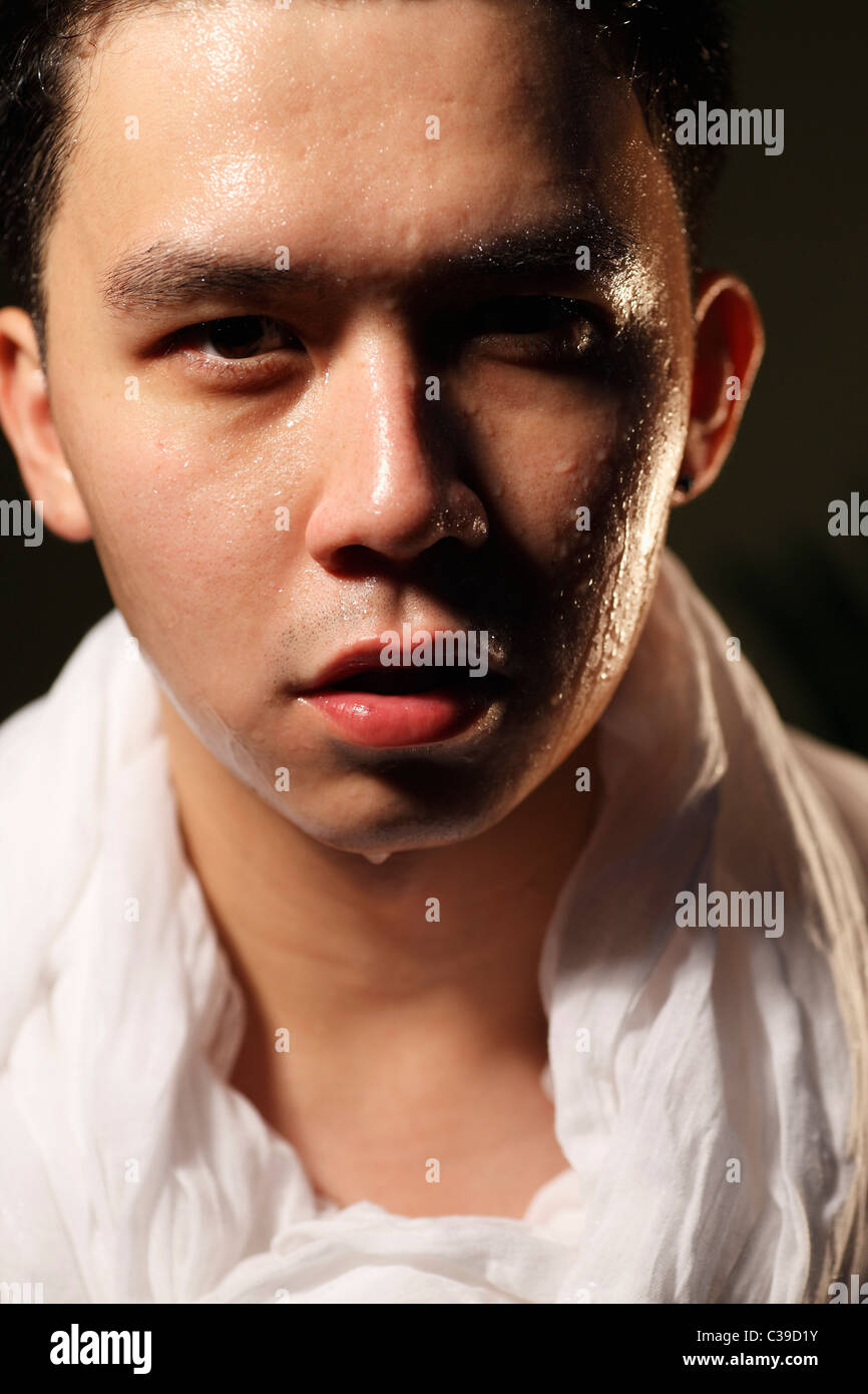 Head shot of Chinese man with water on his face Stock Photo - Alamy