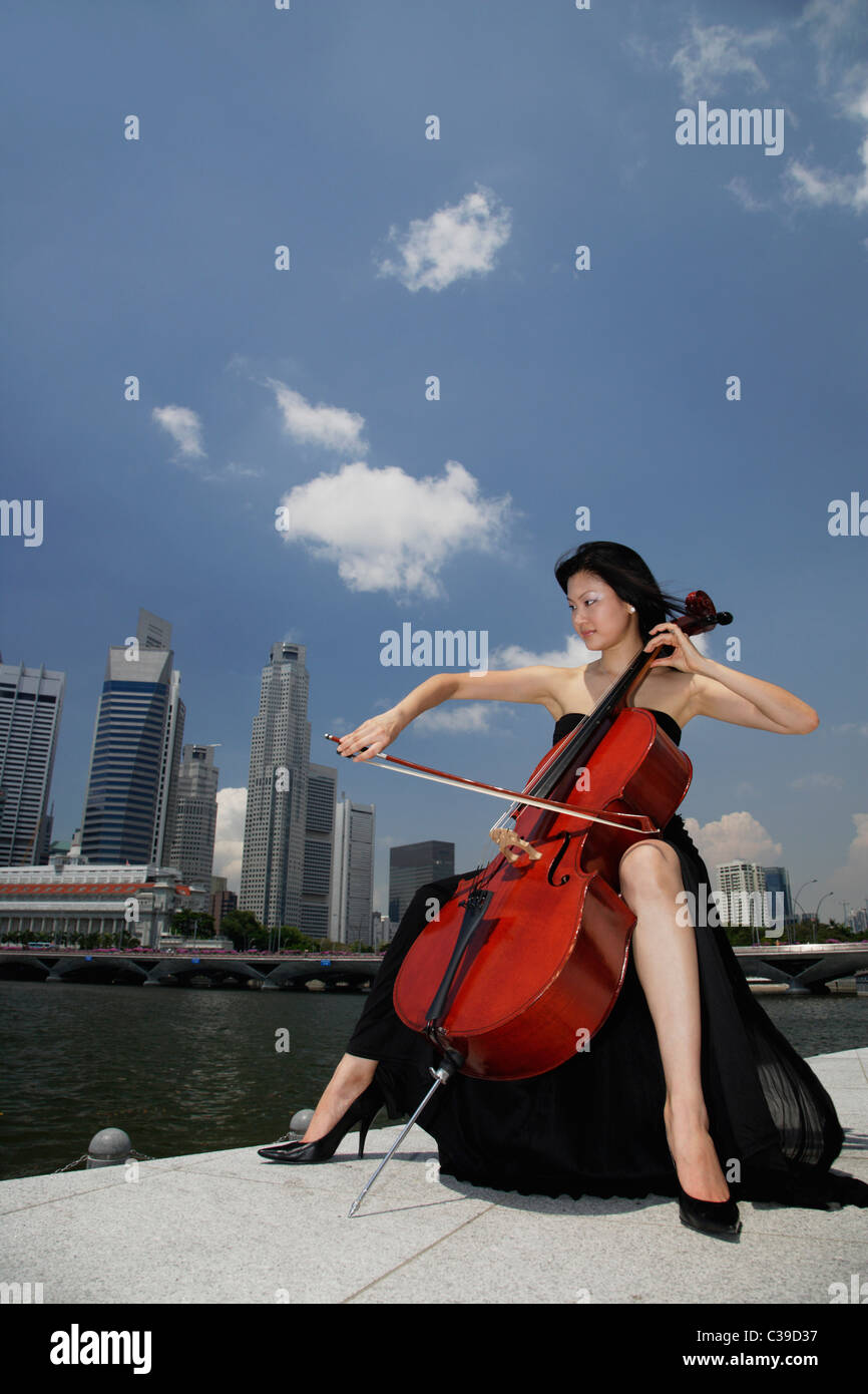 Asian woman playing cello in hi-res stock photography and images - Alamy