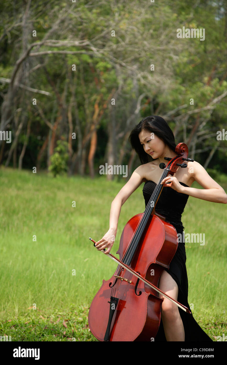 Asian woman playing cello in hi-res stock photography and images - Alamy