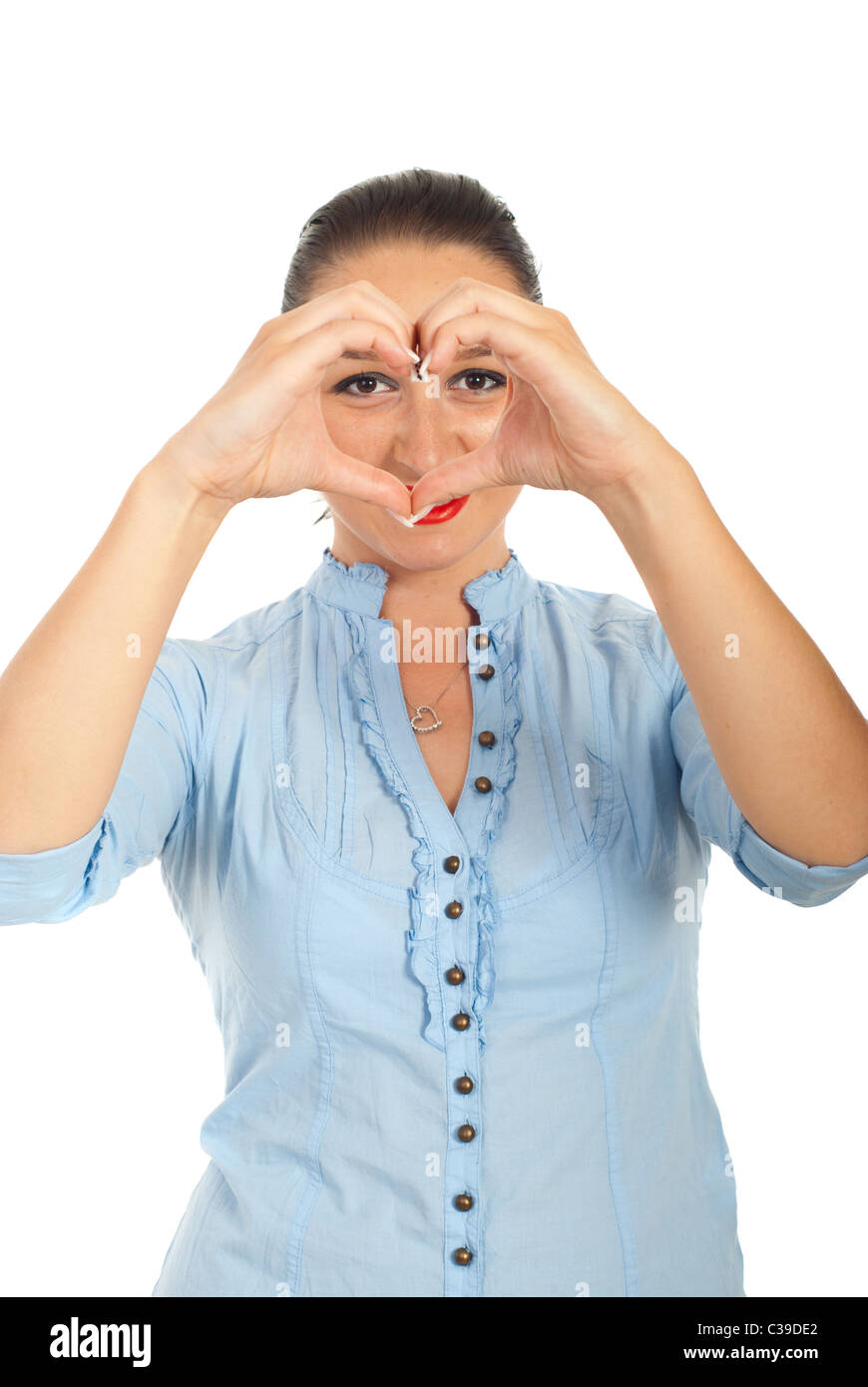 Happy woman forming a heart shape with her hands in front of eyes ...