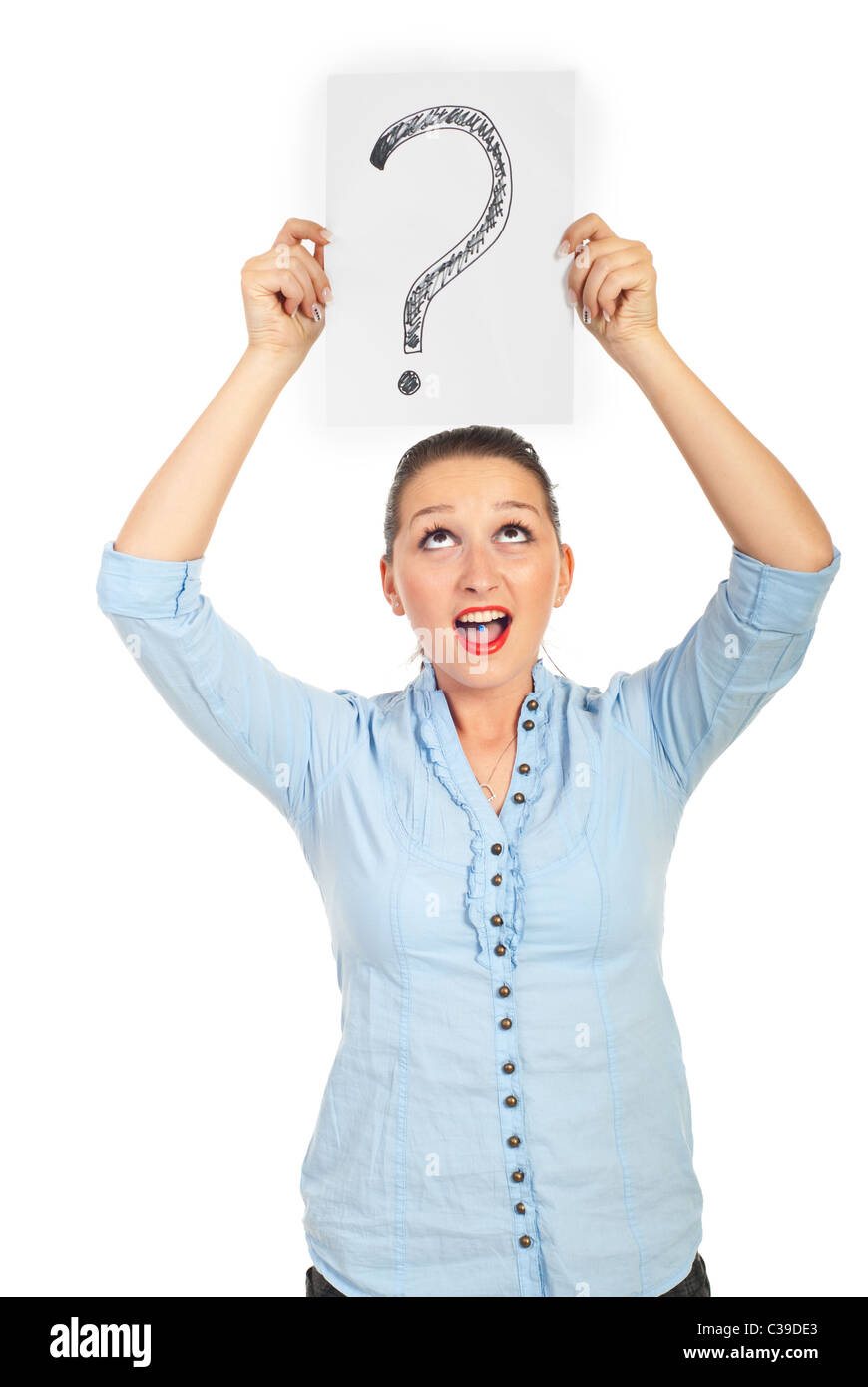 Surprised woman looking up and holding a question mark over head ...