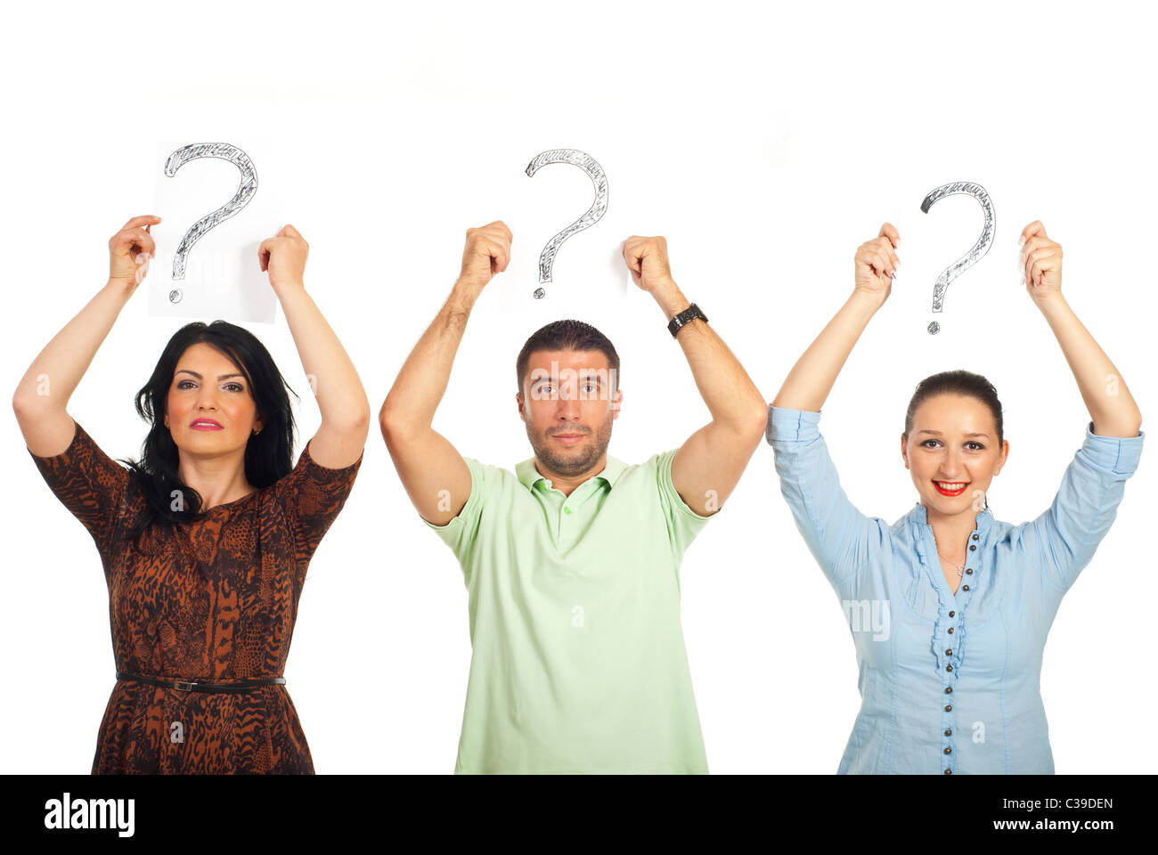 Three casual people standing in a line and holding questions marks over ...