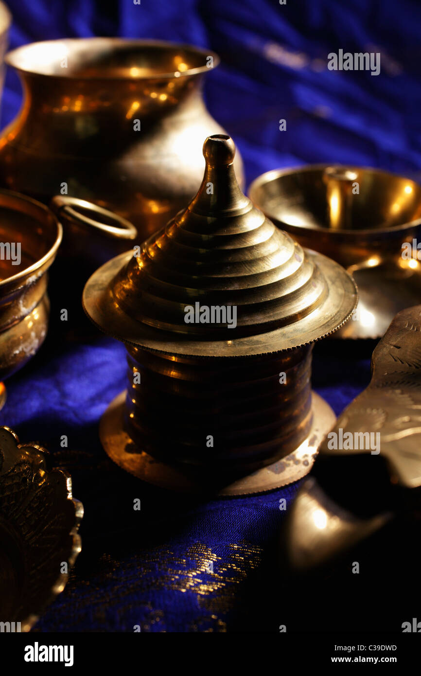 Close up of bronze Indian containers and bowls Stock Photo - Alamy