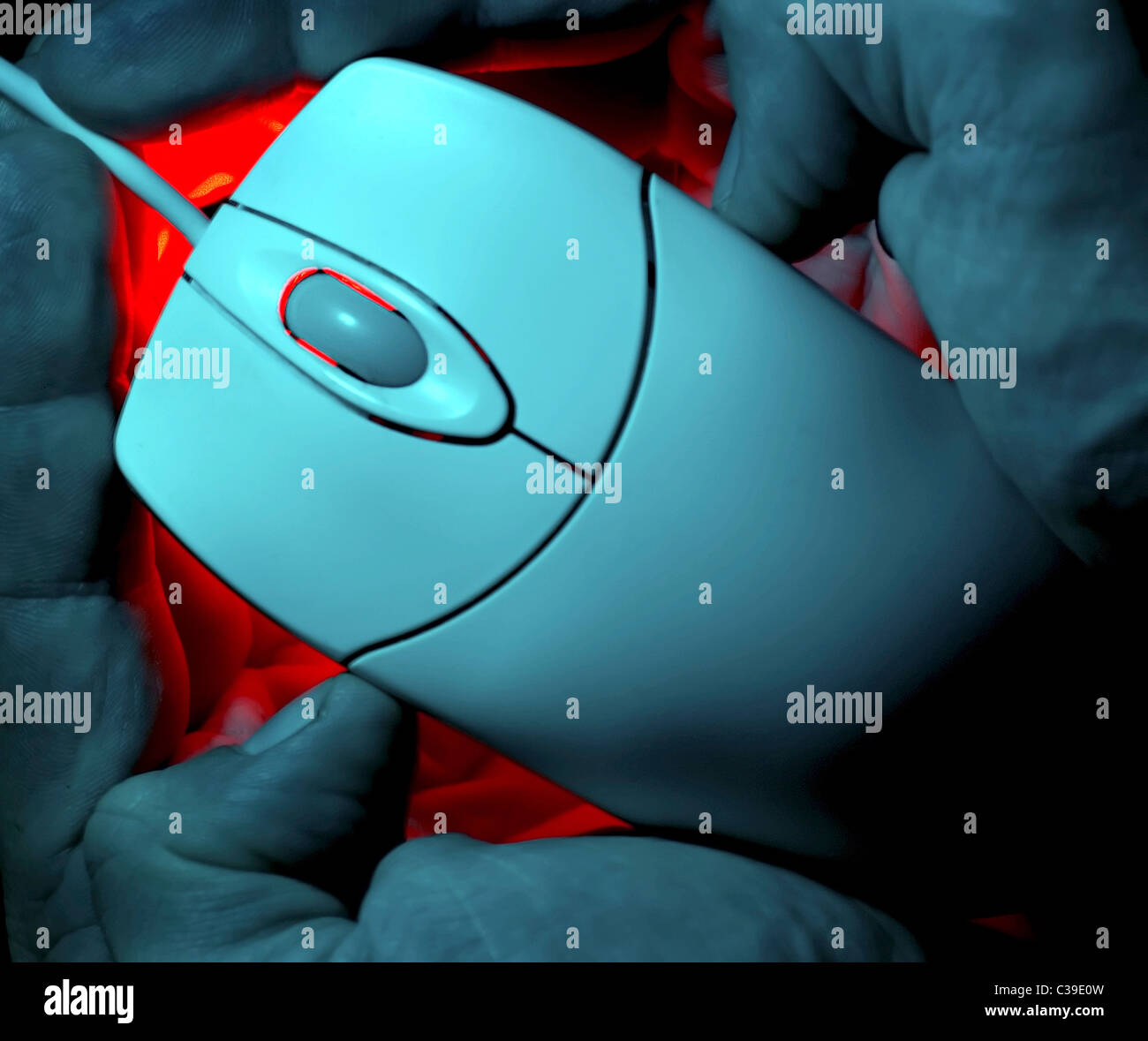 A man holding a computer mouse Stock Photo - Alamy