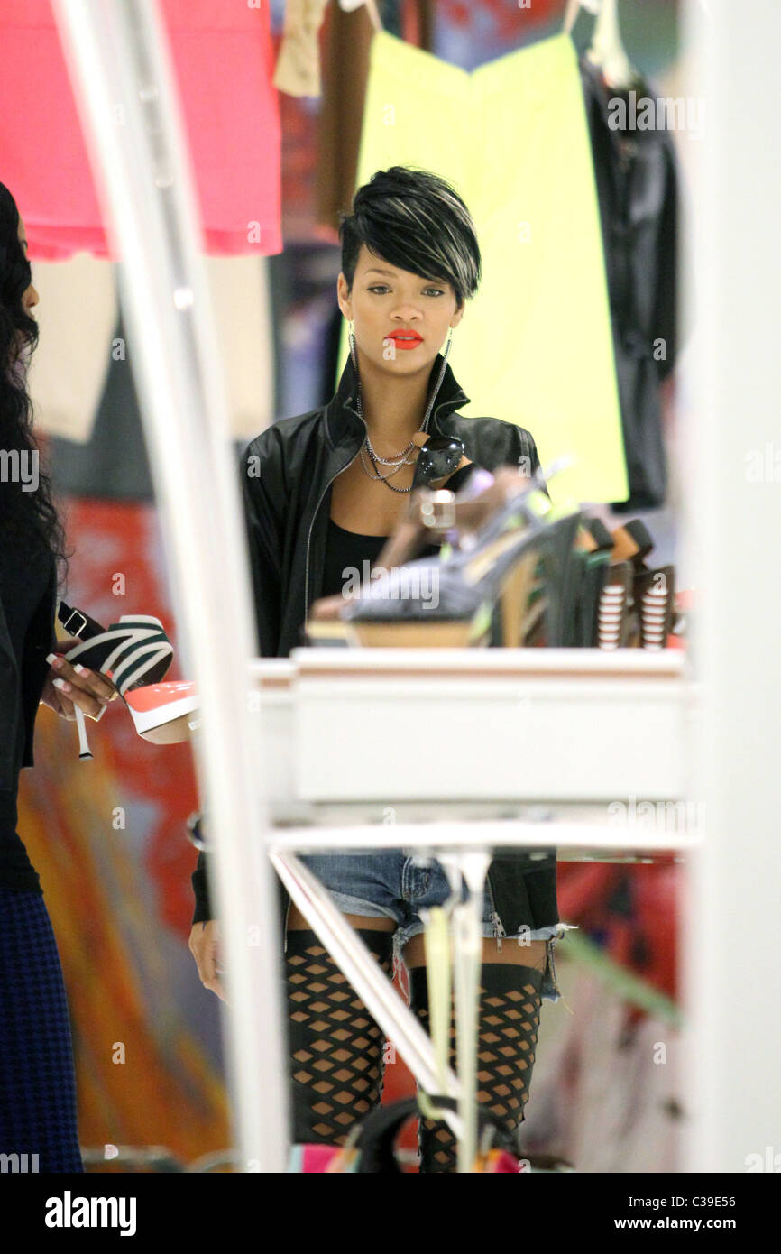 Rihanna shopping at Marni in Soho wearing a bizzare pair of earrings ...