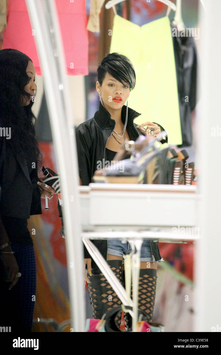 Rihanna shopping at Marni in Soho wearing a bizzare pair of earrings ...