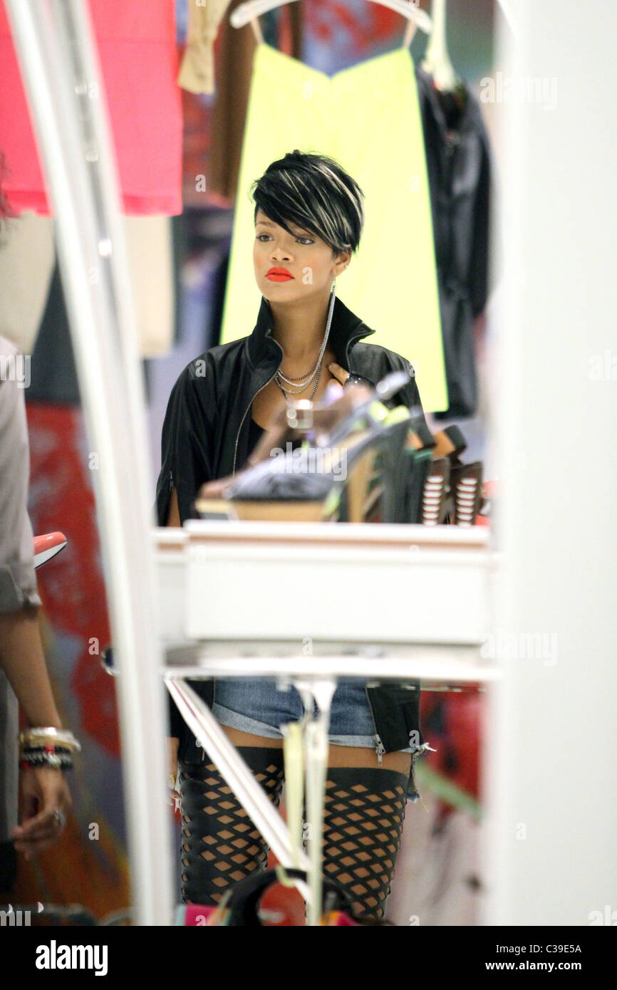 Rihanna shopping at Marni in Soho wearing a bizzare pair of earrings ...