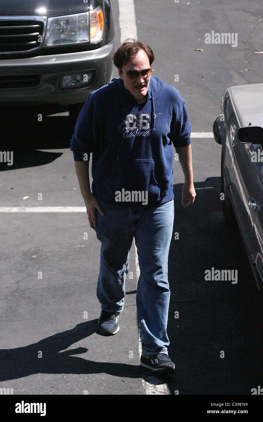 Quentin Tarantino going back to his parked Ford Mustang after having ...