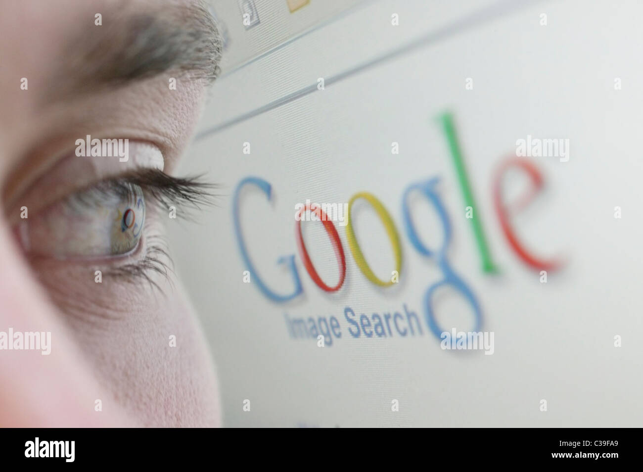 The Google search engine webpage being reflected in an eye Stock Photo ...