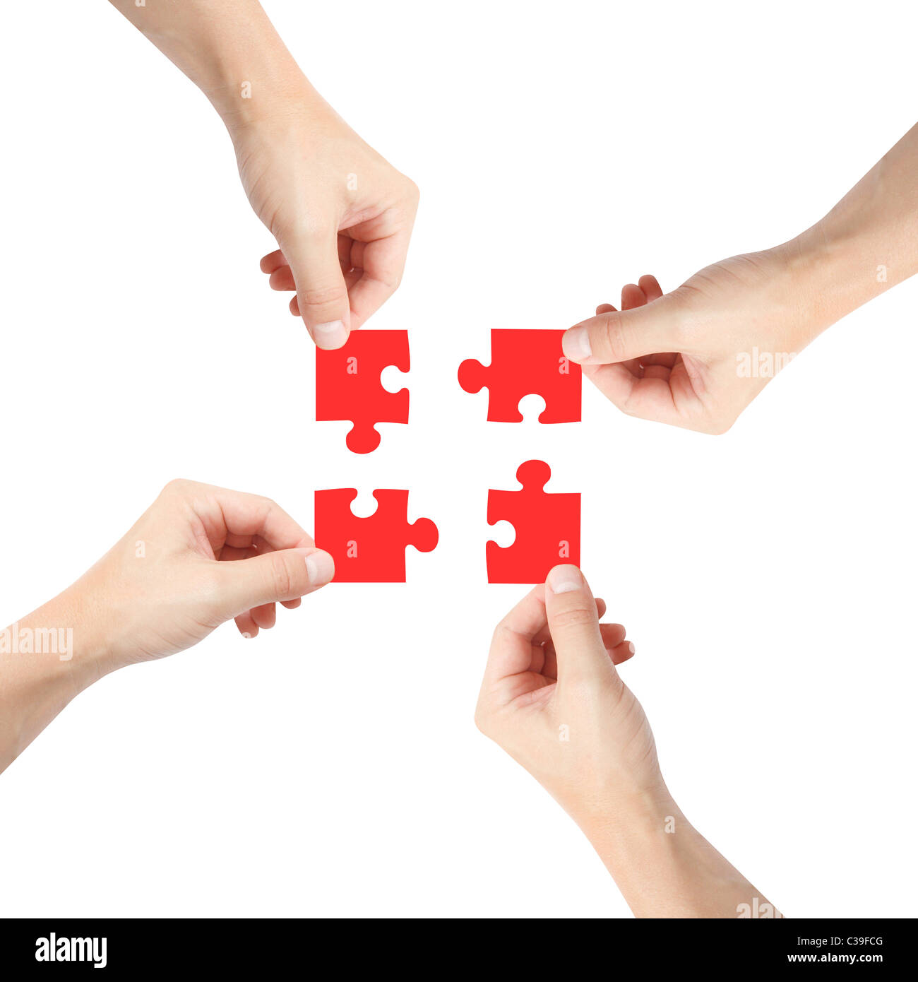 Solving a puzzle with teamwork Stock Photo - Alamy