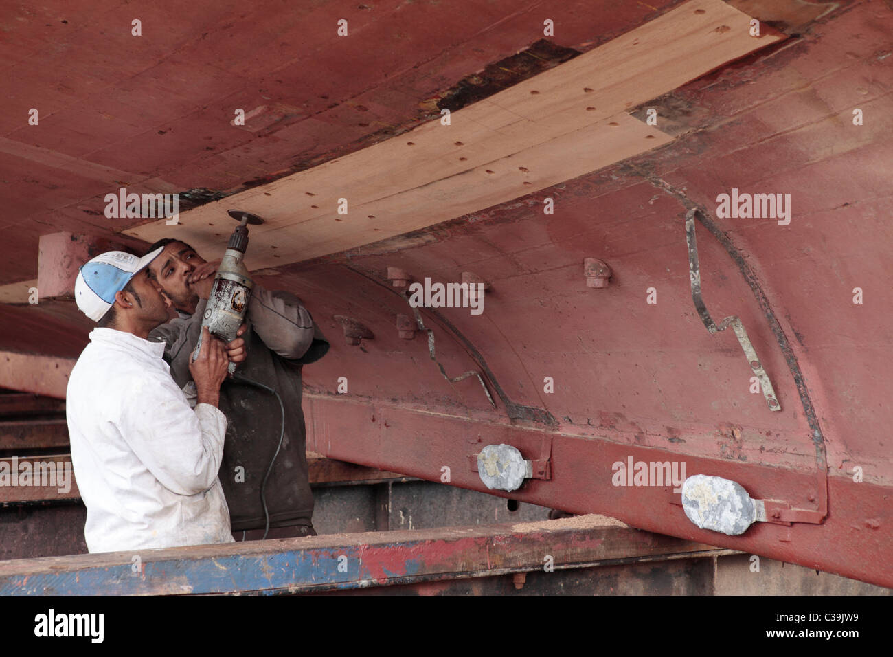 Men repairing fishing boat hi-res stock photography and images - Alamy