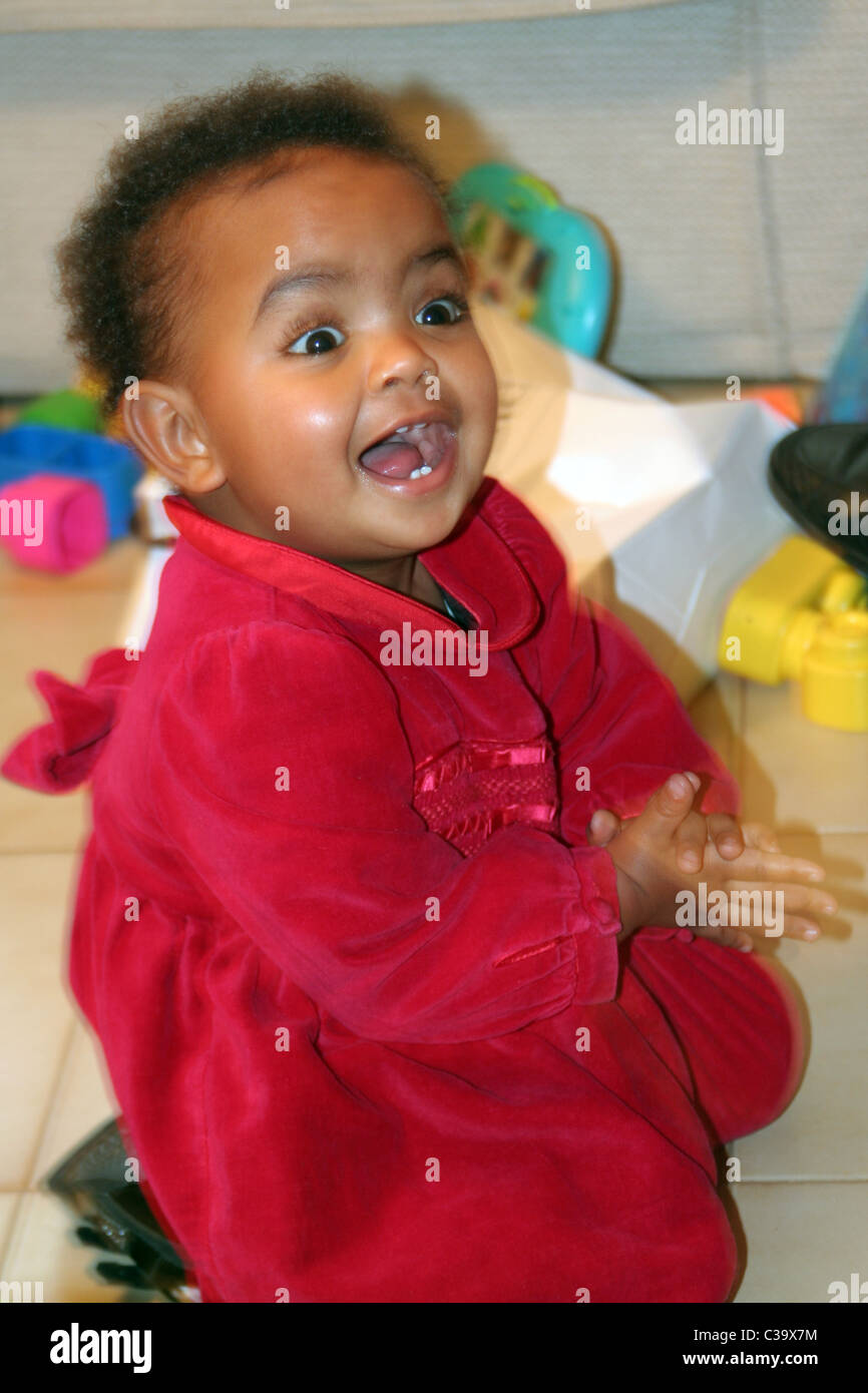 Playful one-year-old girl Stock Photo - Alamy
