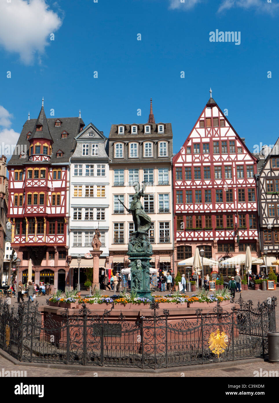 Romer Square with historic timbered houses and Justitia fountain statue ...