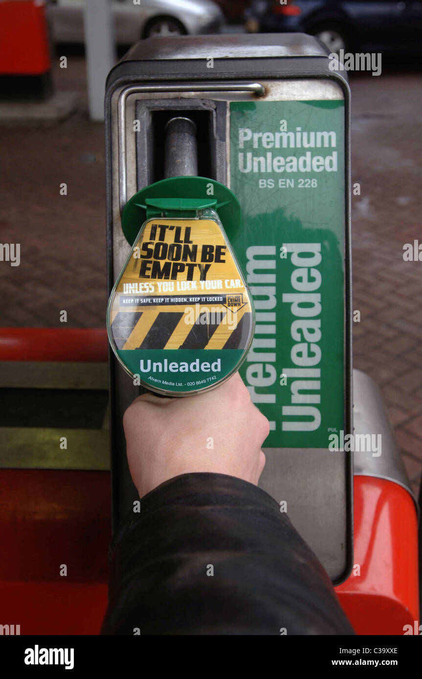 A man using an unleaded petrol pump Stock Photo - Alamy