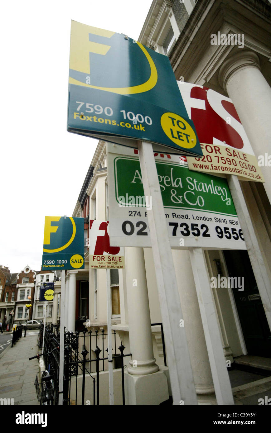 various For Sale and To Let signs outside houses Stock Photo - Alamy