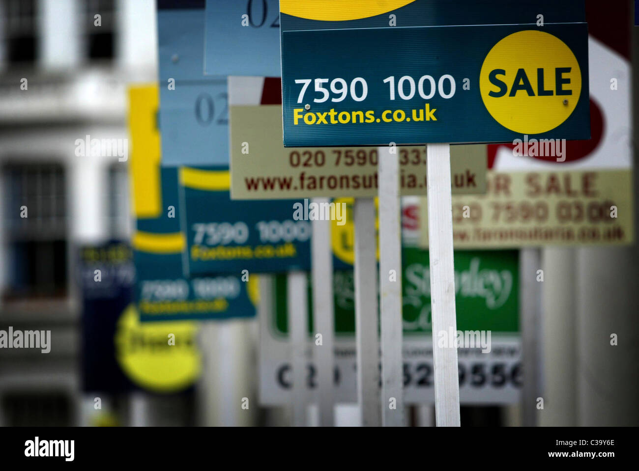 various For Sale and To Let signs outside houses Stock Photo - Alamy