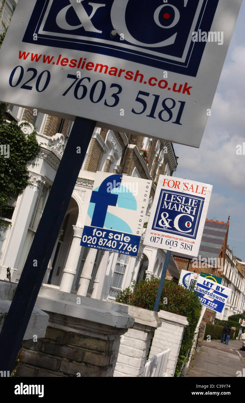 various For Sale and To Let signs outside houses Stock Photo - Alamy